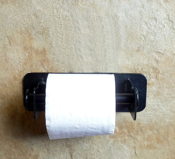 Our Loo Roll holder takes a standard toilet roll and roll changing is easy